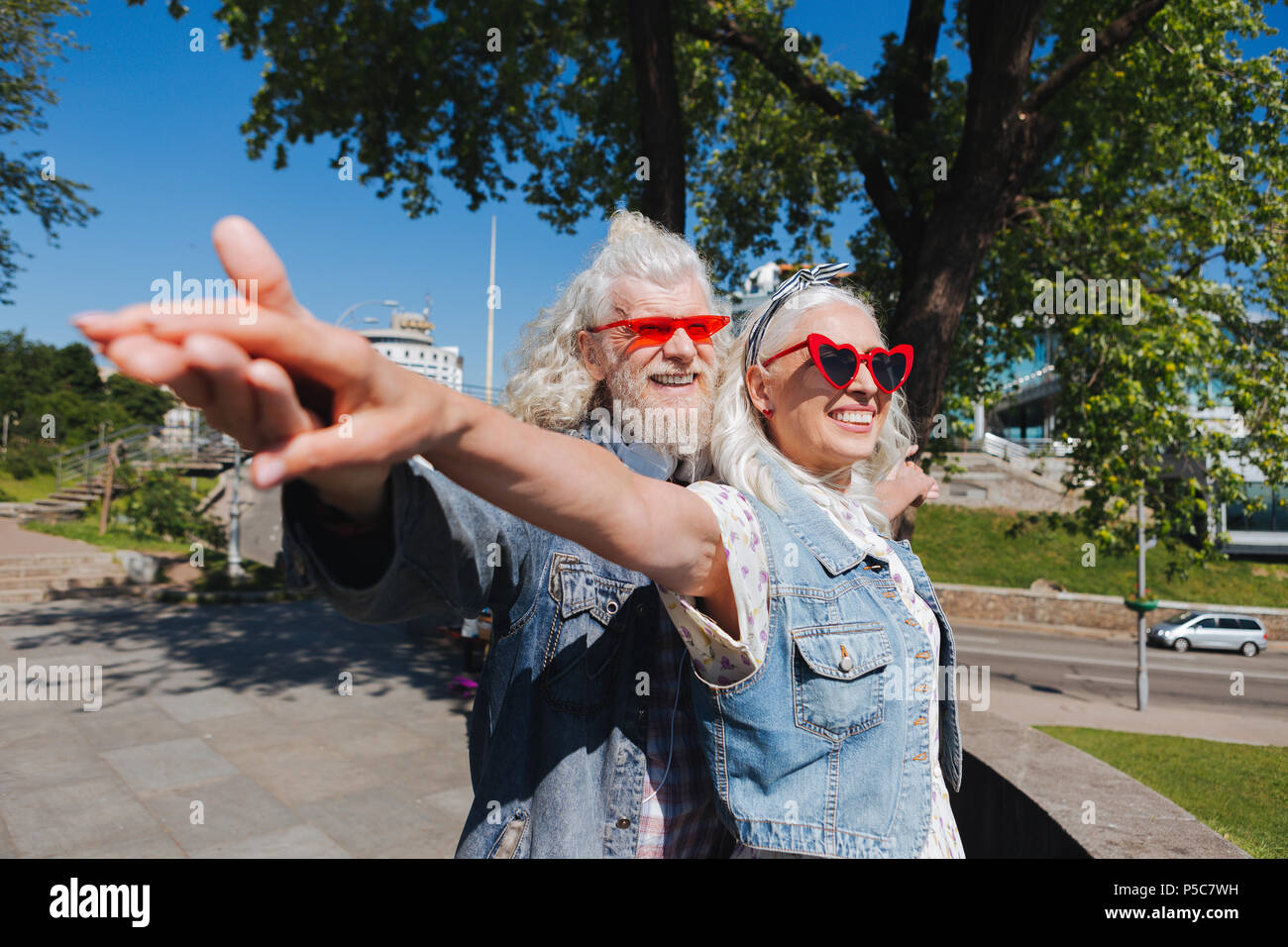 Nice delighted couple enjoying life Stock Photo - Alamy