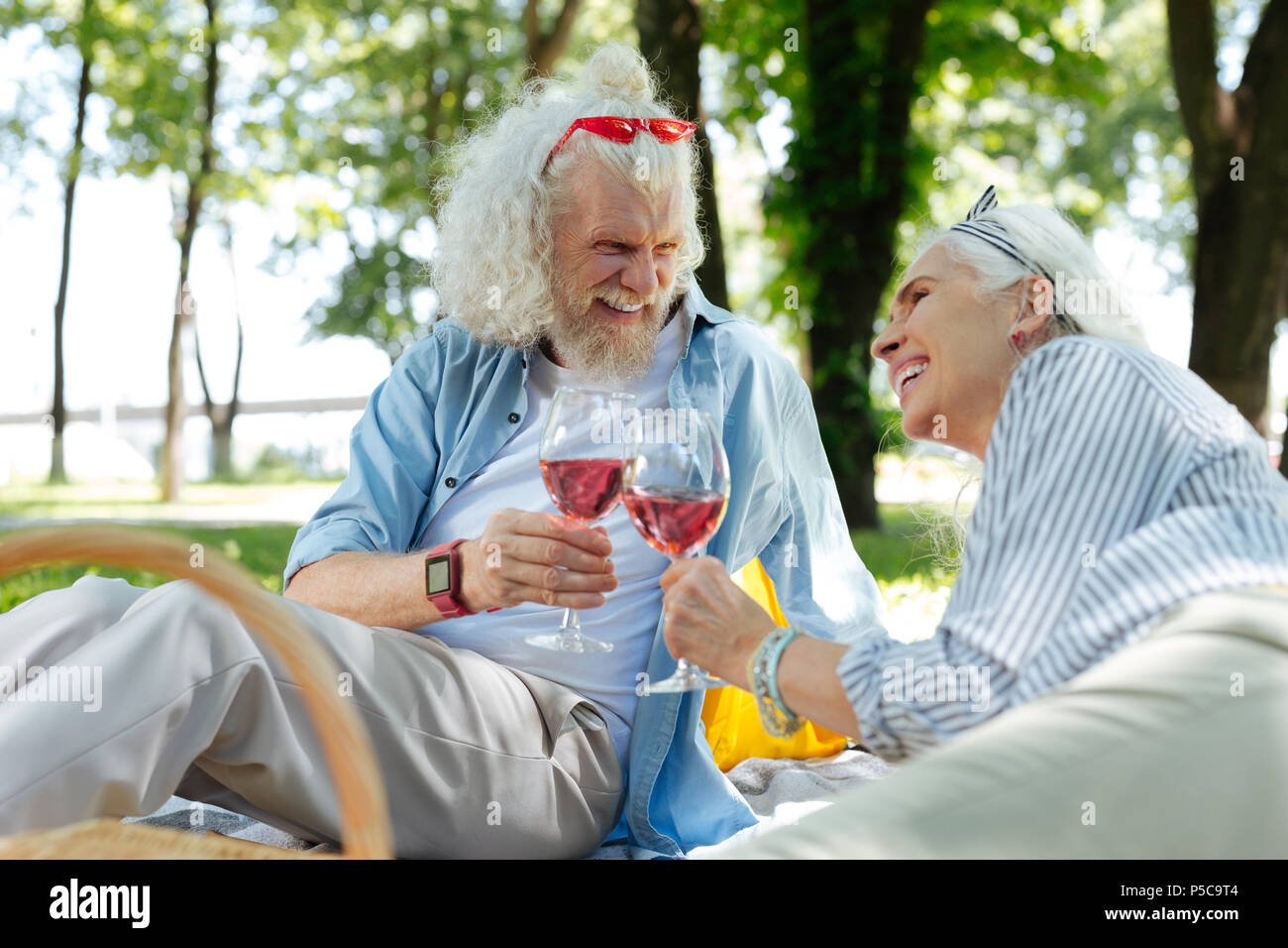 Cheerful positive couple laughing Stock Photo - Alamy