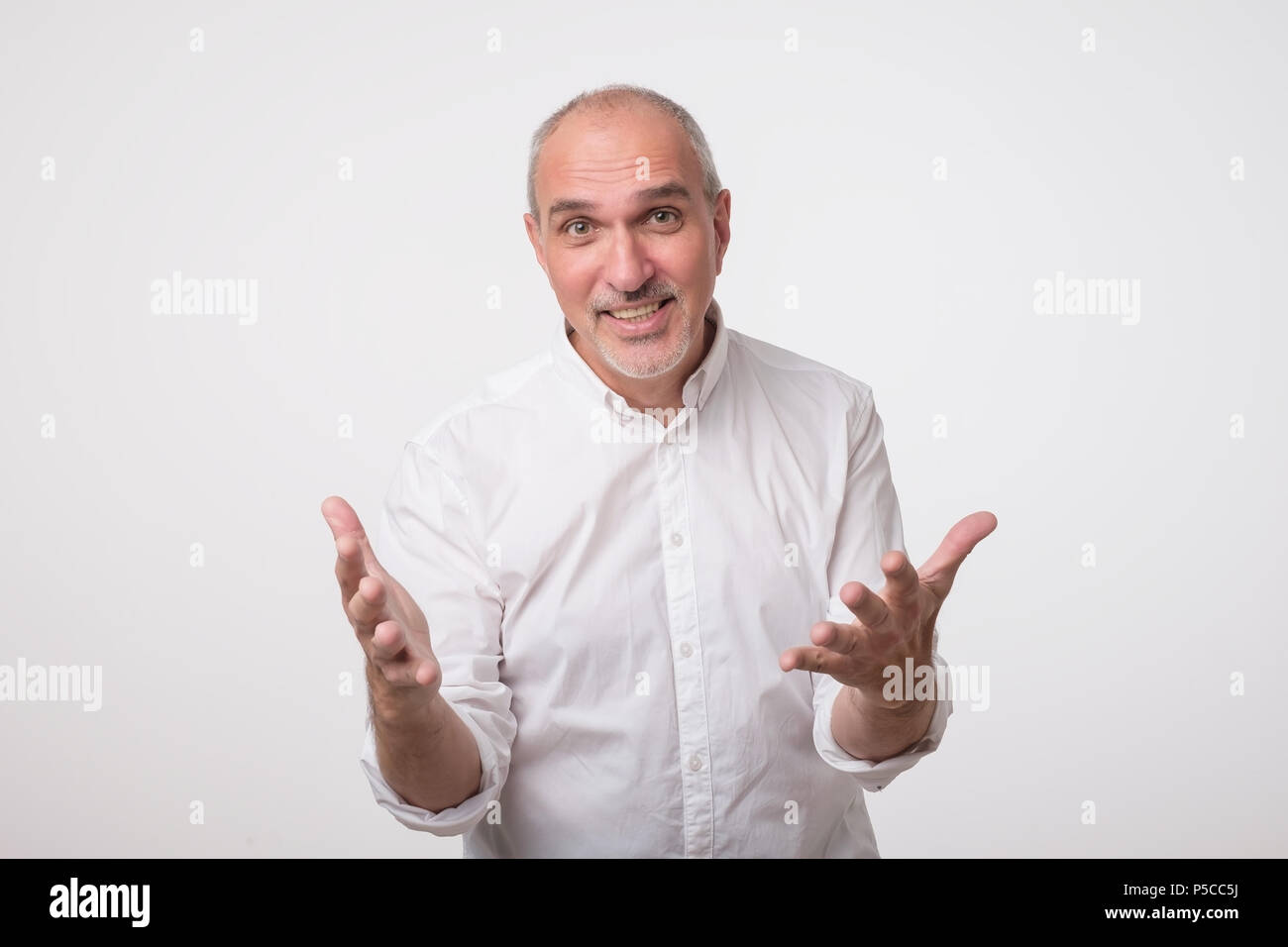 Inspired mature italian man expressing strong emotion while explaining ...