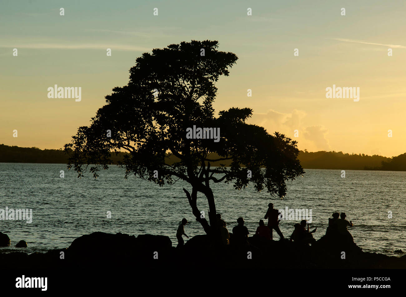 Sunset with people silhouettes at Chidiya Tapu, Port Blair, Andaman and ...
