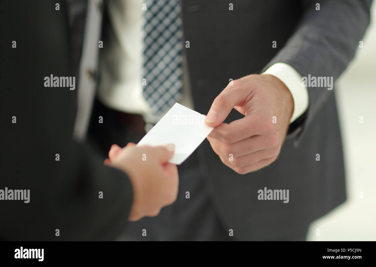 Exchange business card for first time meet Stock Photo - Alamy