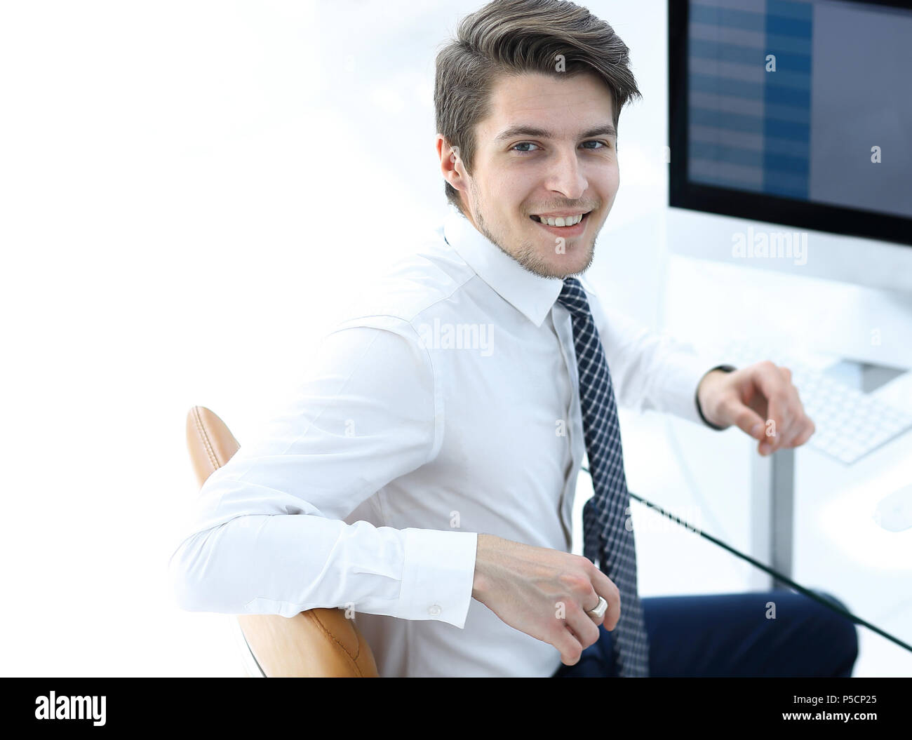 employee sitting in front of a computer screen Stock Photo - Alamy