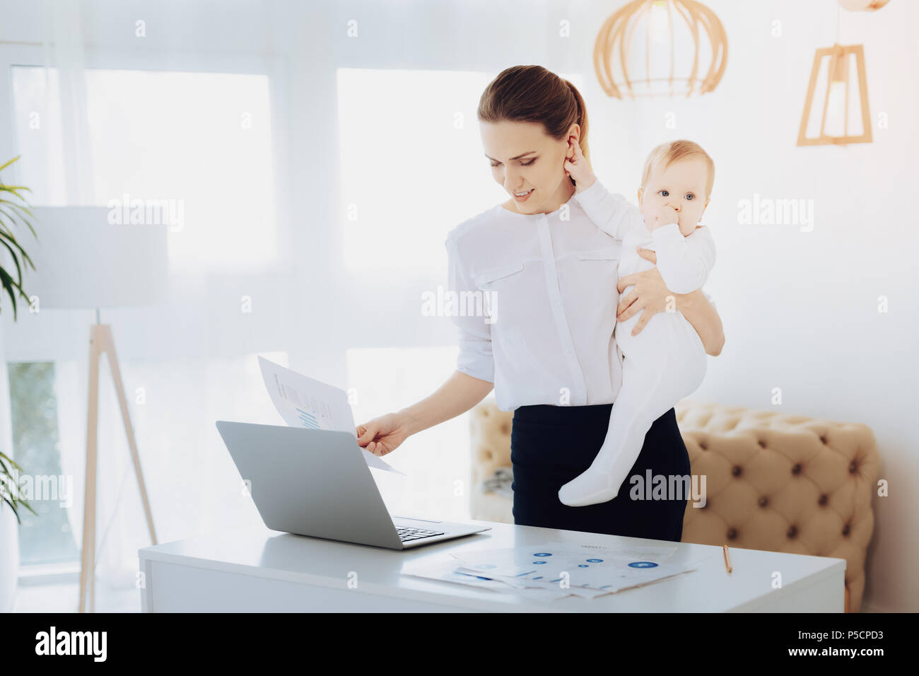 Concentrated office worker checking information Stock Photo - Alamy