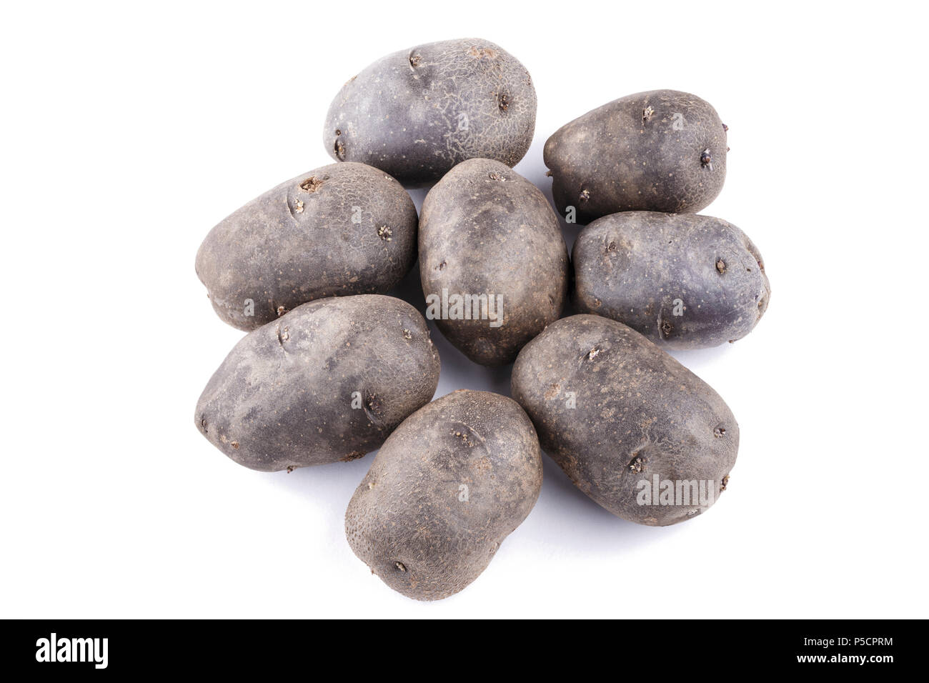 whole purple potato isolated on white background Stock Photo - Alamy