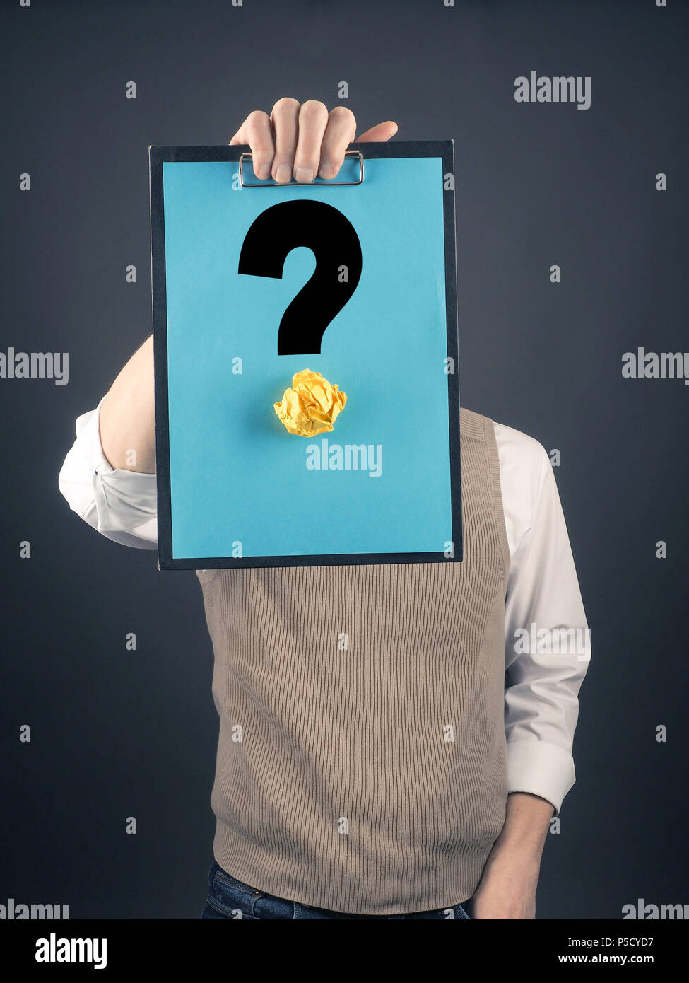 Businessman holding a clipboard with a question mark, creativity or ...