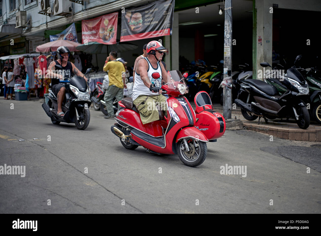 Disabled man riding a motorcycle sidecar combo. Thailand Southeast Asia ...