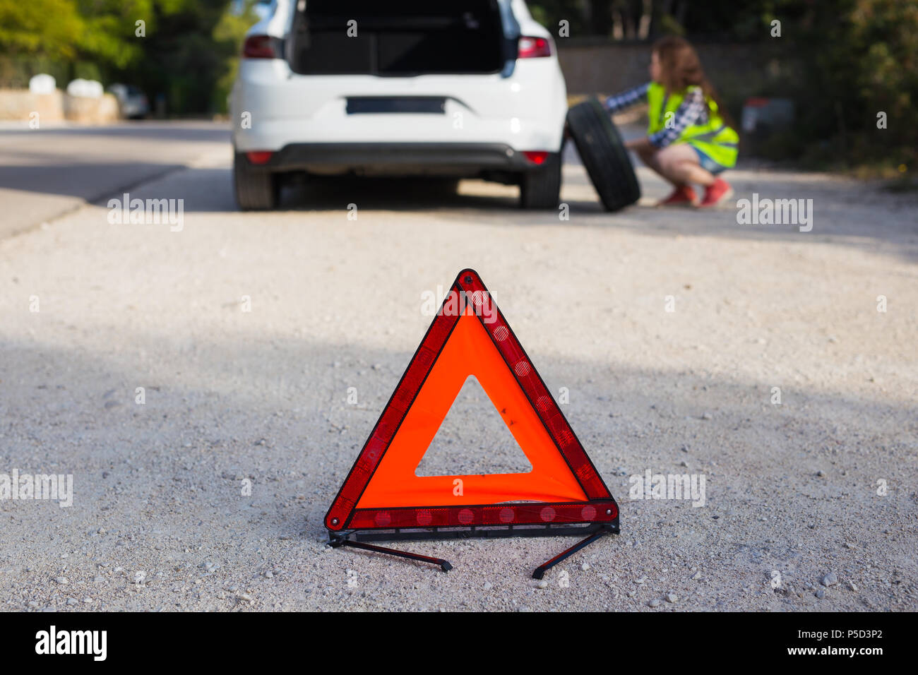 Triangular sign of the accident on the background of a girl about to ...