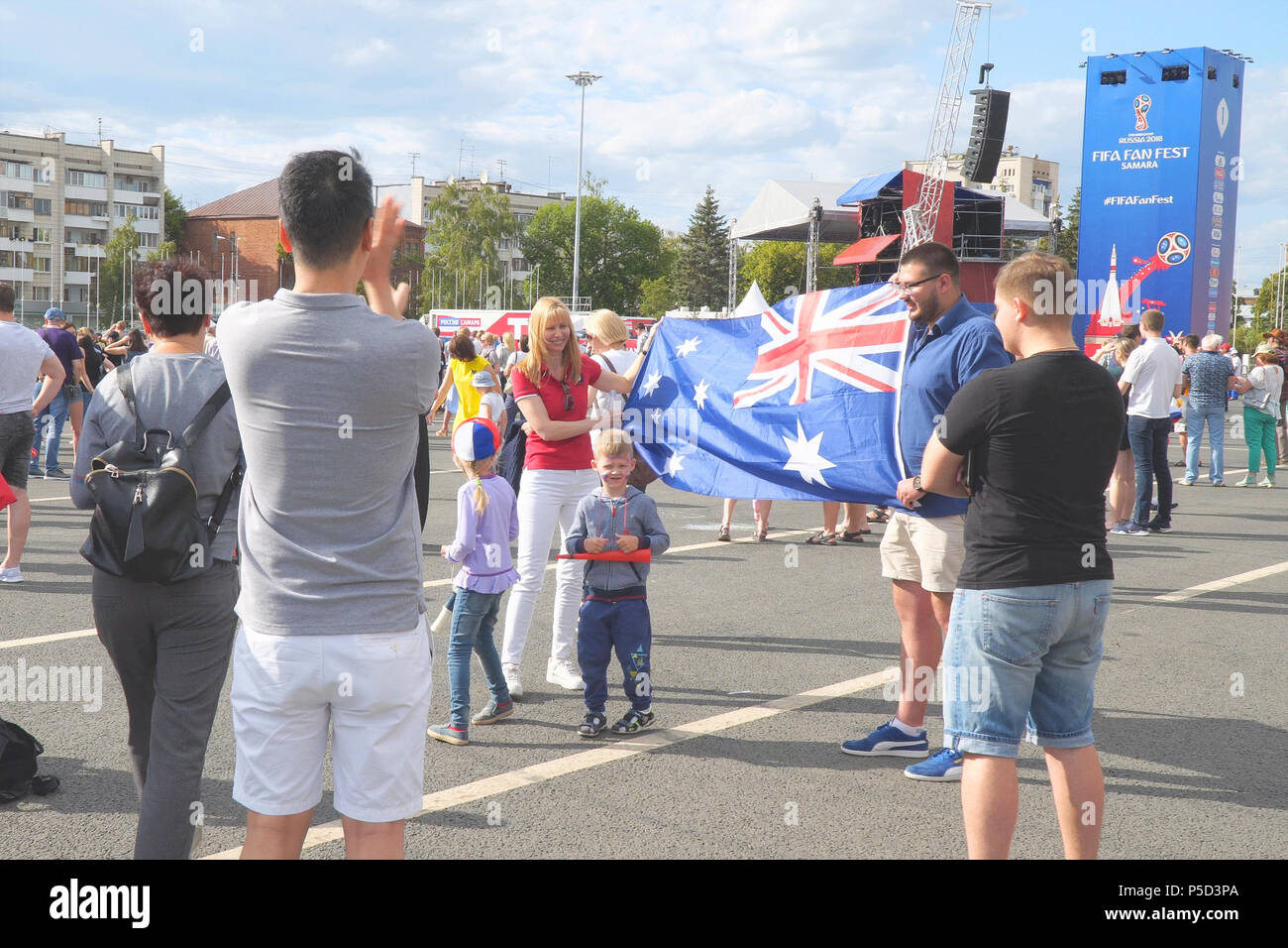 Football fans with the flag of Australia in the fan zone of the world ...