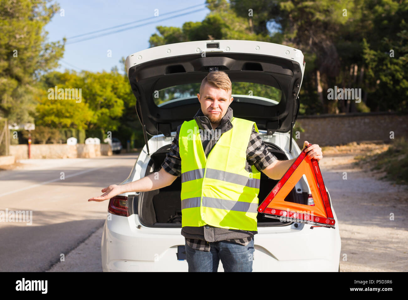 At the man of a trouble with a car he gets a red triangular emergency ...