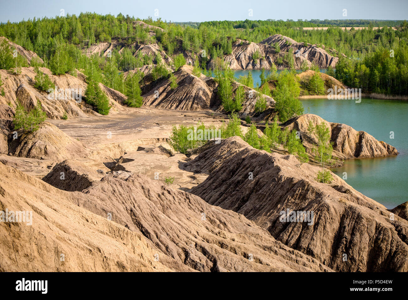 Picture of hilly terrain with green trees and river Stock Photo - Alamy