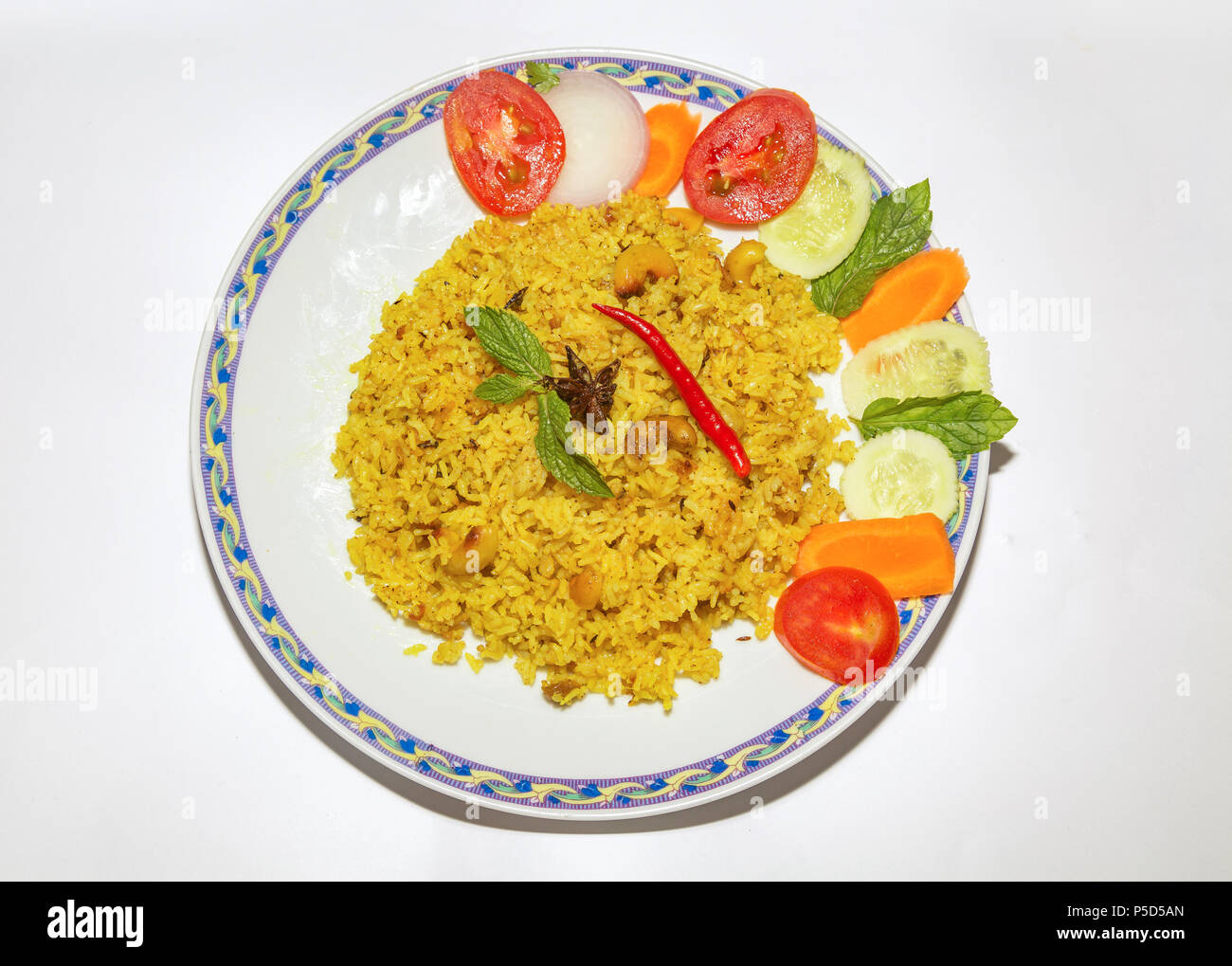 Indian vegetable fried pulao rice with salad isolated on white ...