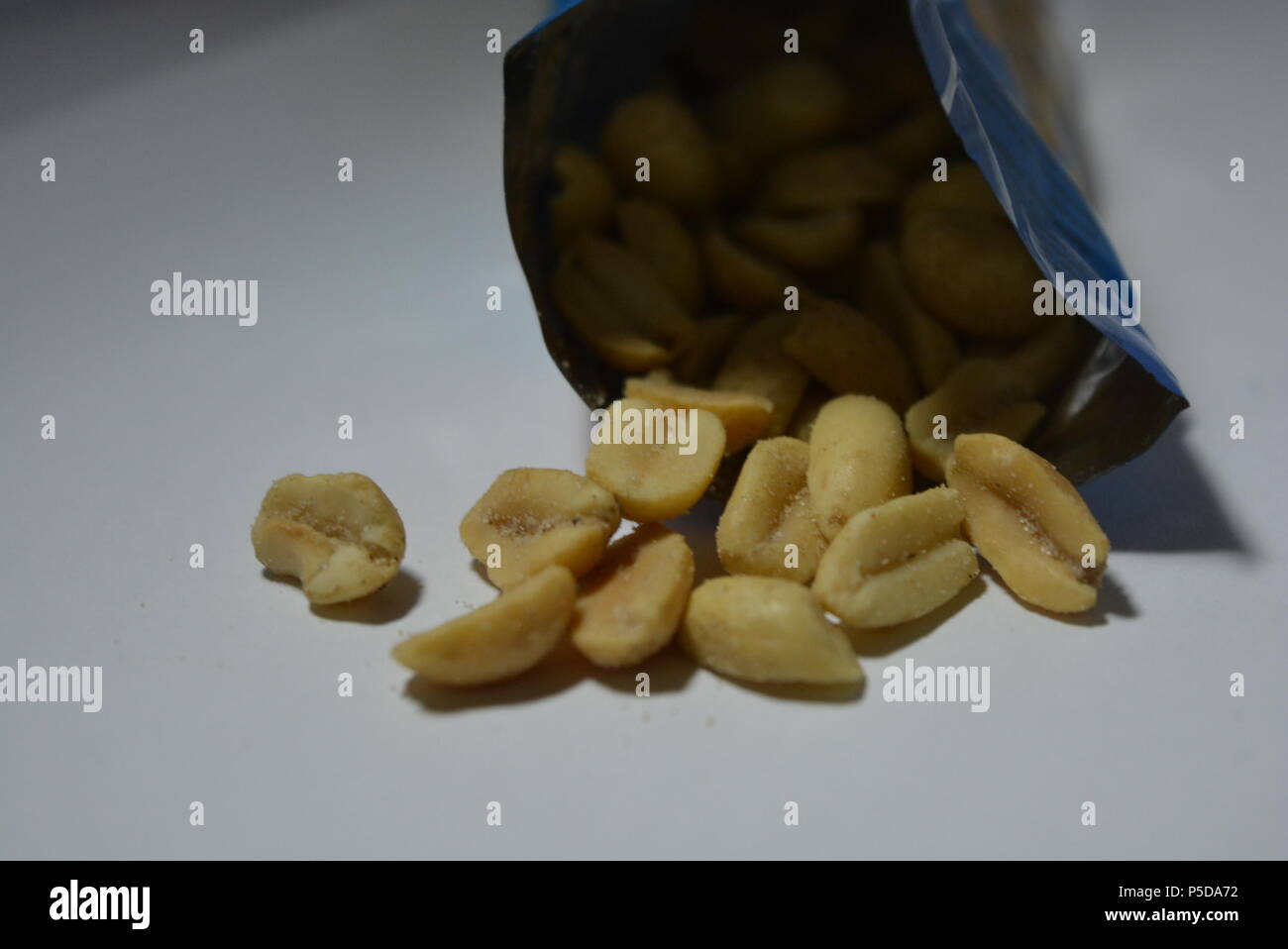 Delicious and healthy food, nuts, a lot of peanuts poured out of ...