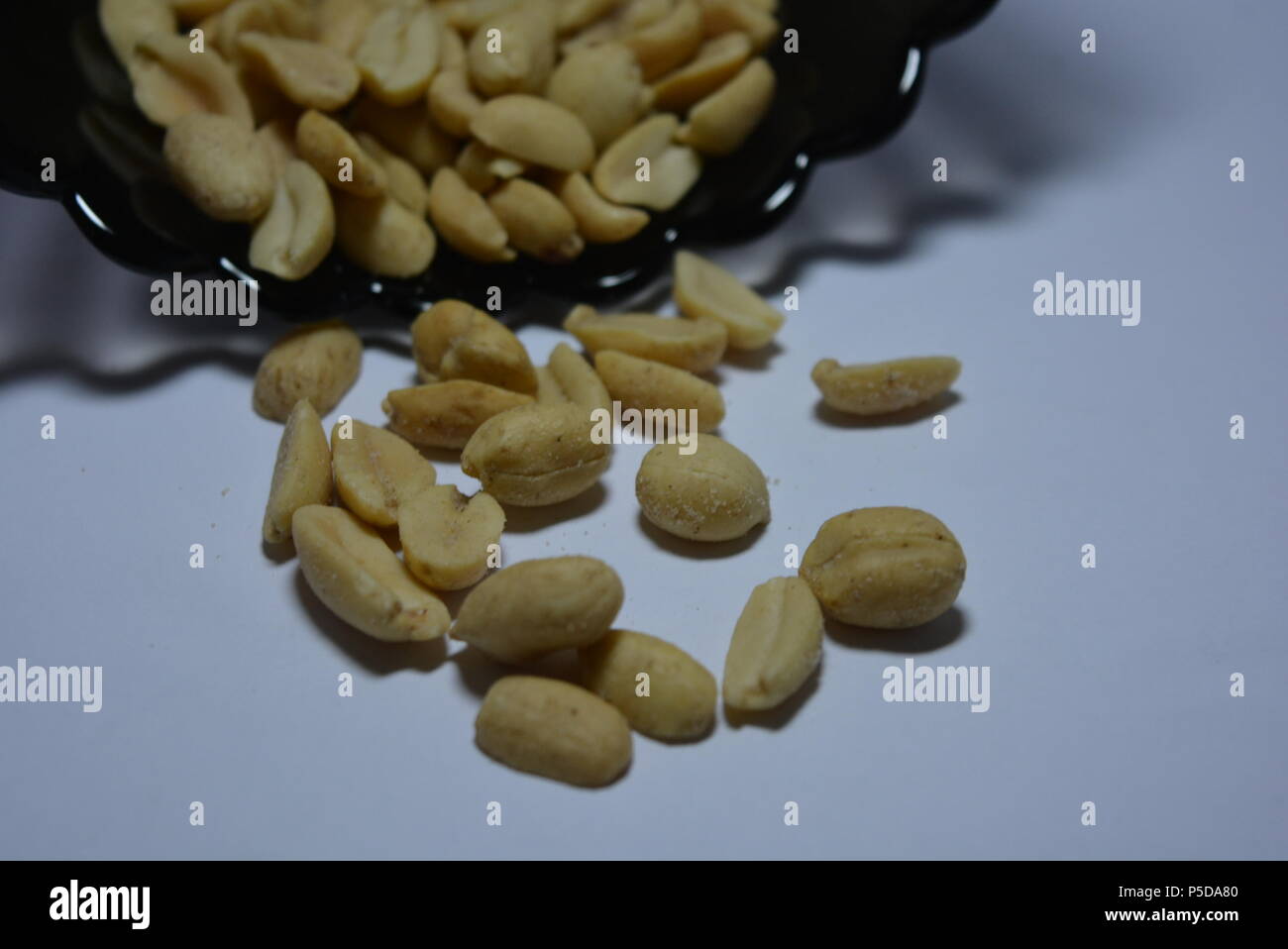 Delicious and healthy food, nuts, lots of peanuts arranged in a black ...