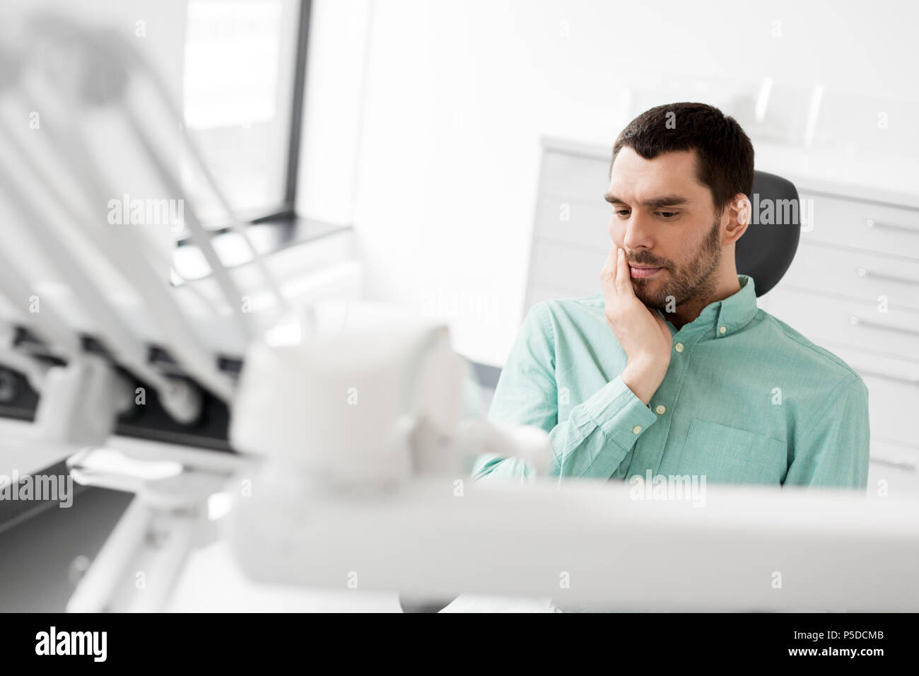 patient having toothache at dental clinic office Stock Photo - Alamy