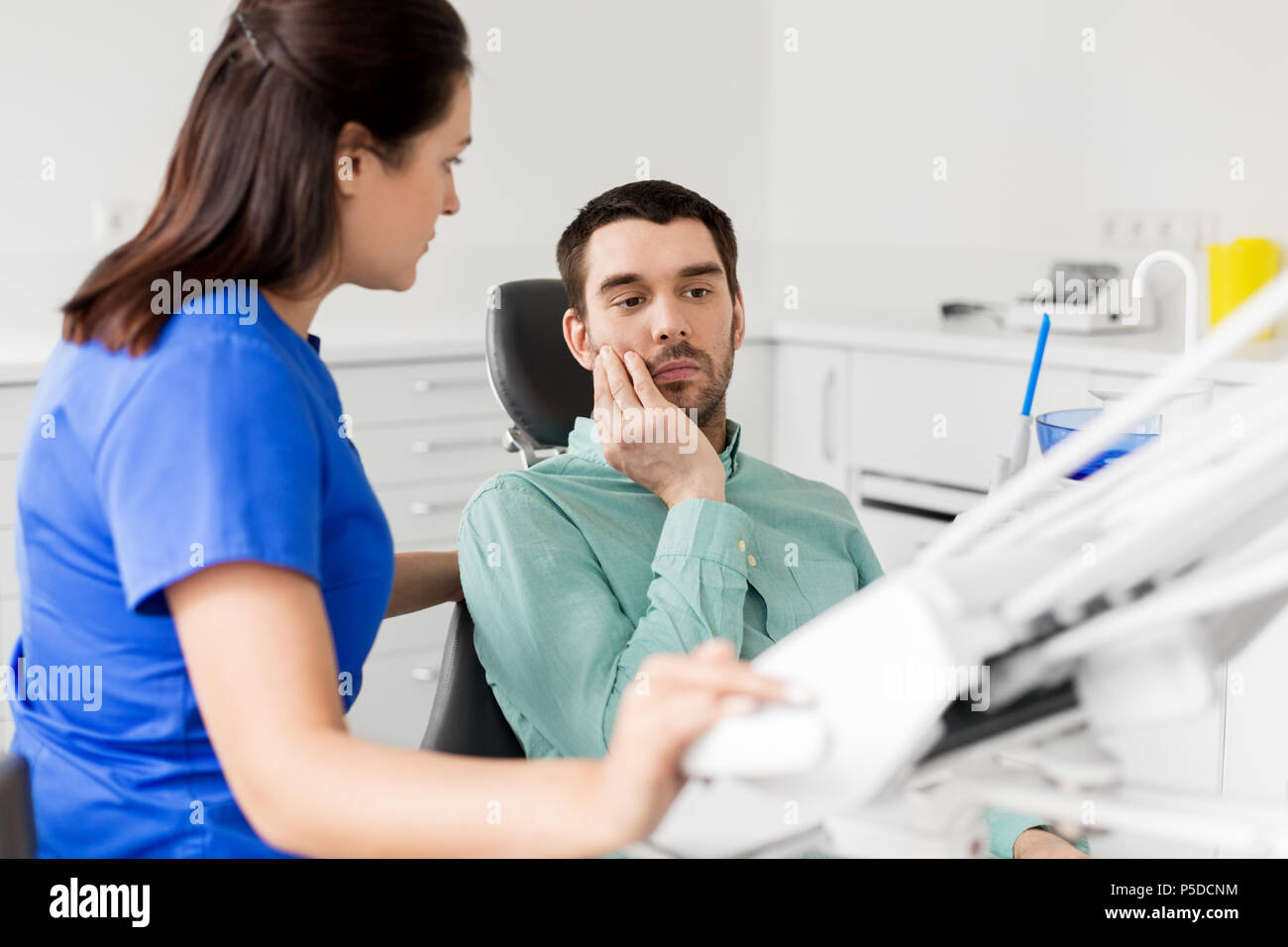 patient with toothache at dentist office Stock Photo - Alamy