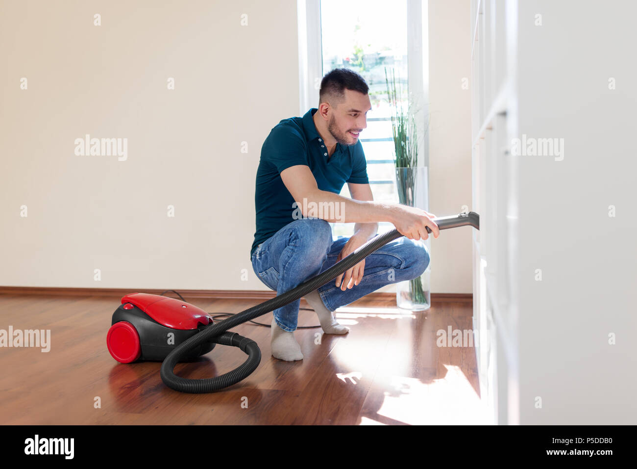 Man vacuum bed hi-res stock photography and images - Alamy