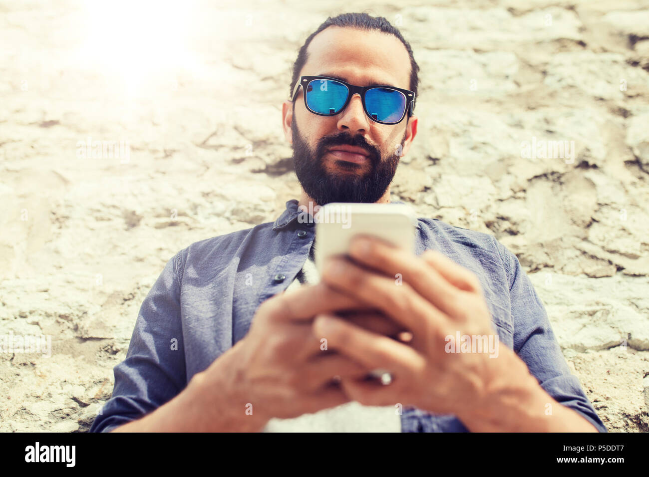 Young happy man texting message hi-res stock photography and images - Alamy