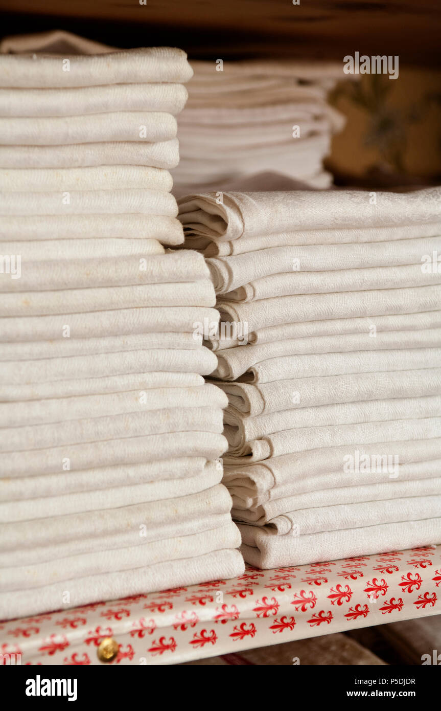 Stacked linen in linen cupboard Stock Photo - Alamy