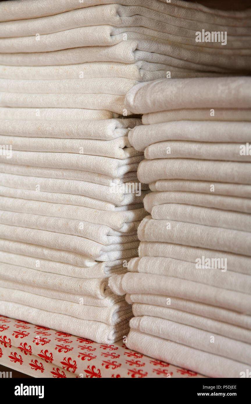 Stacked linen in linen cupboard Stock Photo - Alamy