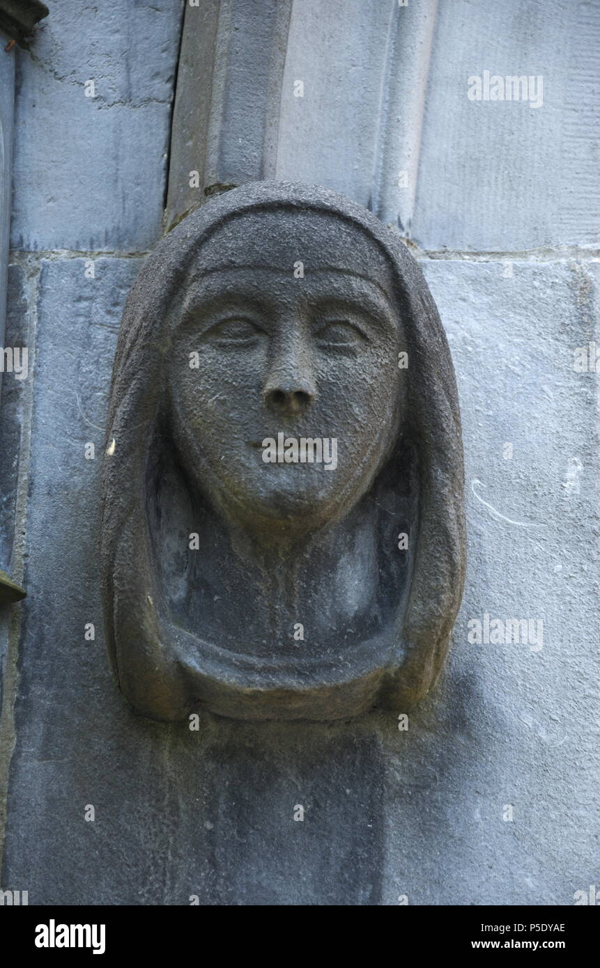 Stone portraits outside temple gate hotel Ennis Stock Photo - Alamy