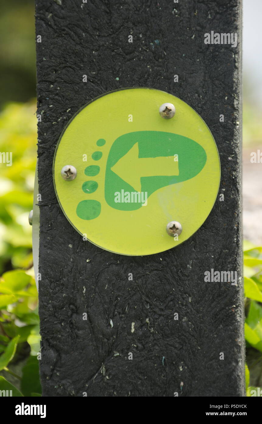 A signpost pointing to the left in Clare Ireland Stock Photo - Alamy