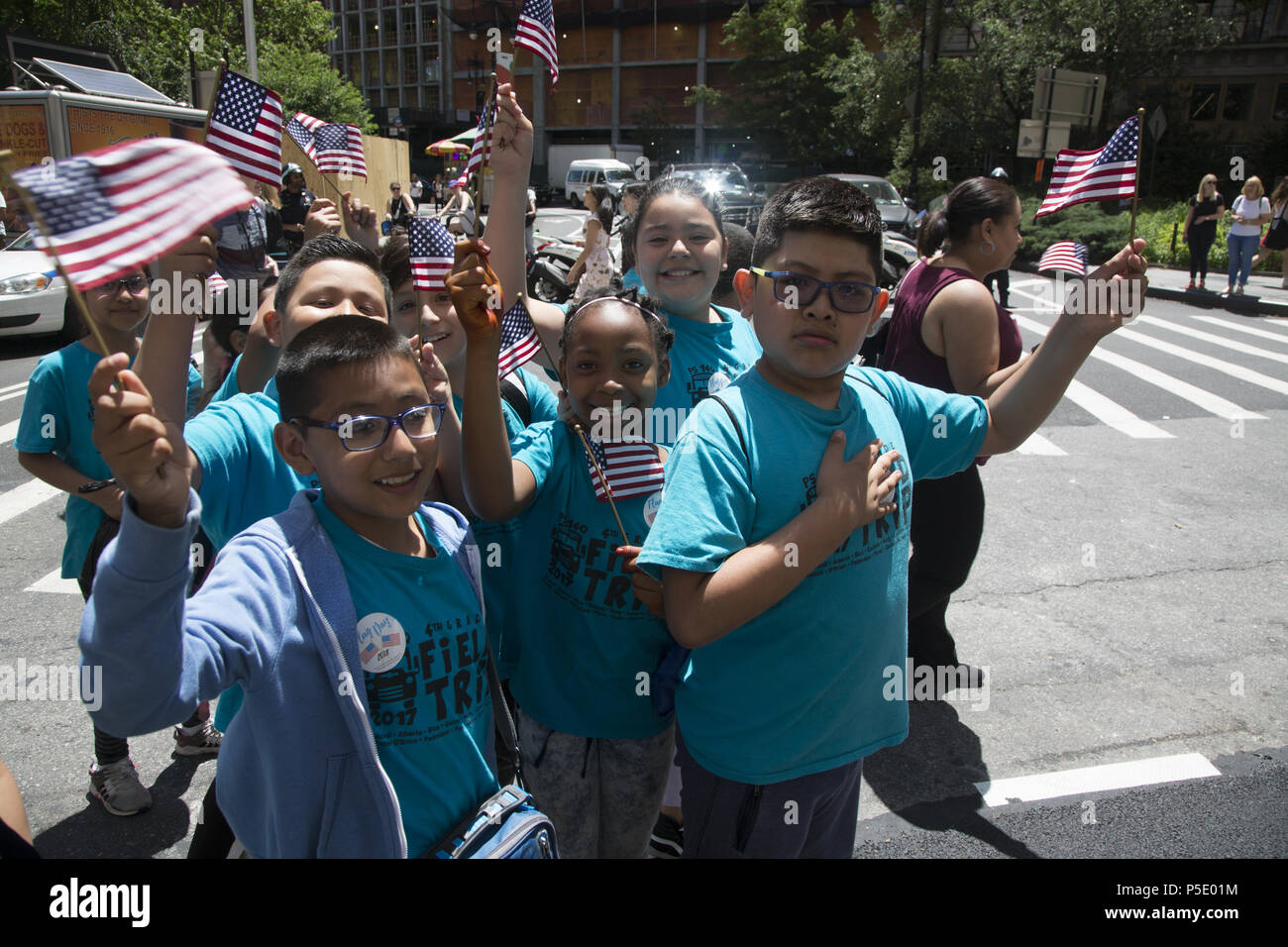 Public school children march in lower Manhattan along Broadway at the ...