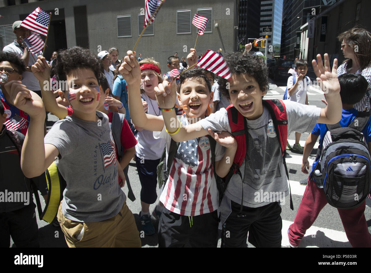 Public school children march in lower Manhattan along Broadway at the ...