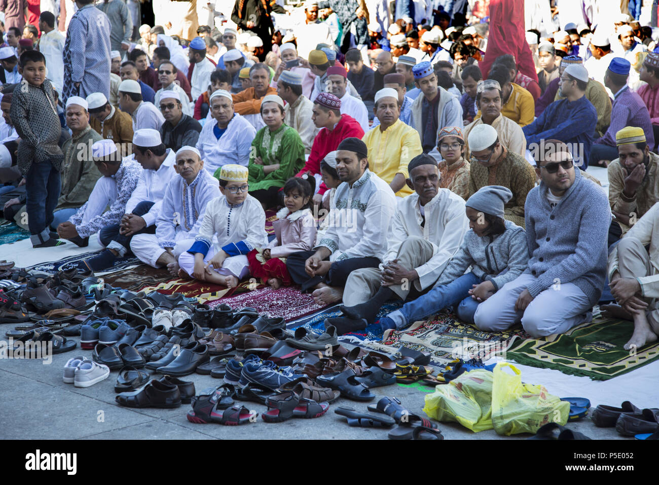 Muslim men pray on Eid on McDonald Ave in Brooklyn NY in the "Little ...