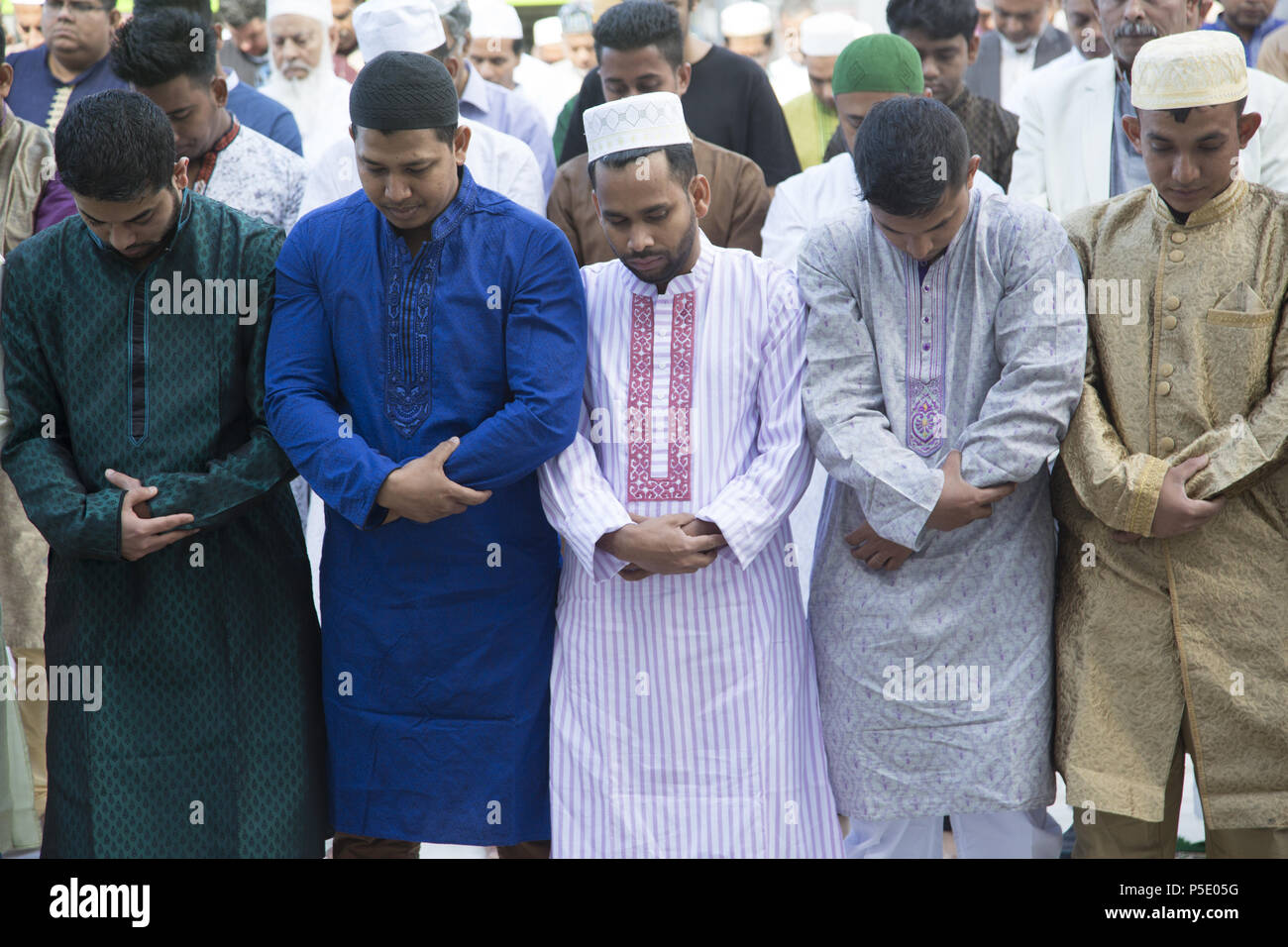 Muslim men pray on Eid on McDonald Ave in Brooklyn NY in the "Little ...