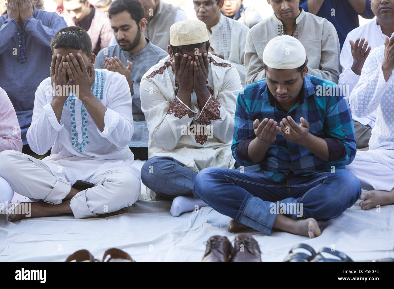 Muslim men pray on Eid on McDonald Ave in Brooklyn NY in the "Little ...