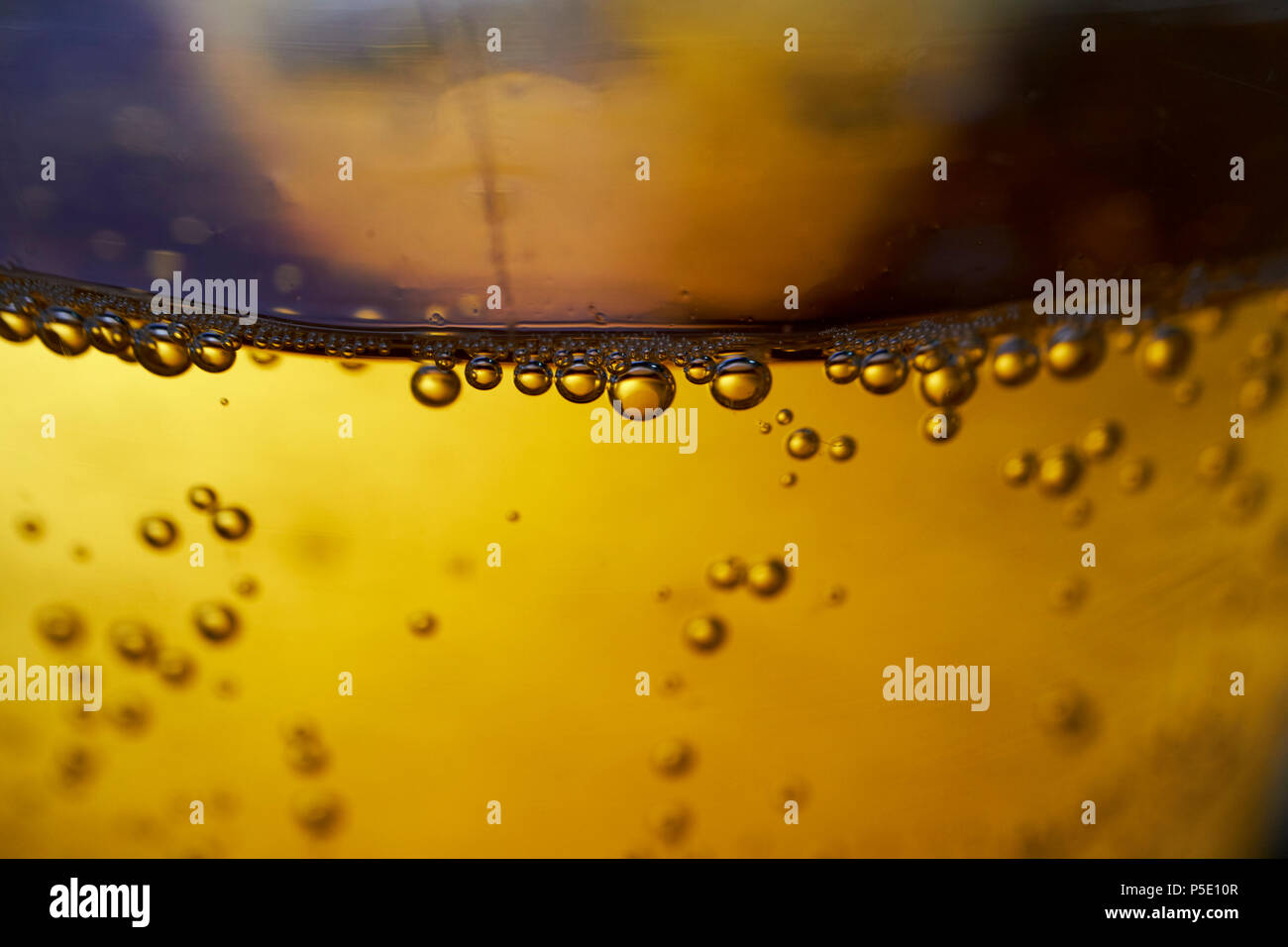 carbon dioxide bubbles in a glass of fizzy drink. In this case cider ...