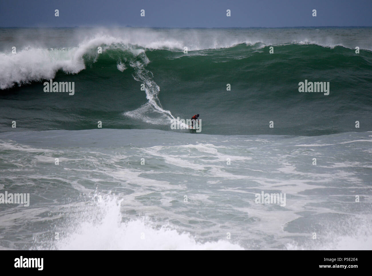 Nazare portugal big wave surfer hi-res stock photography and images - Alamy