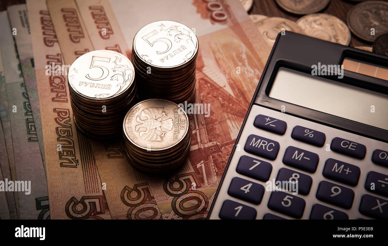 handful of Russian rubles with calculator close up Stock Photo - Alamy