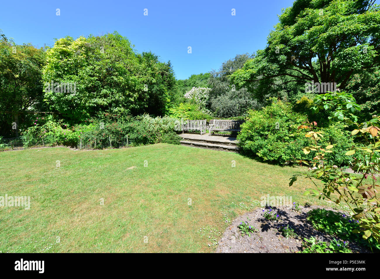 A rest area in an English country garden in summertime Stock Photo - Alamy