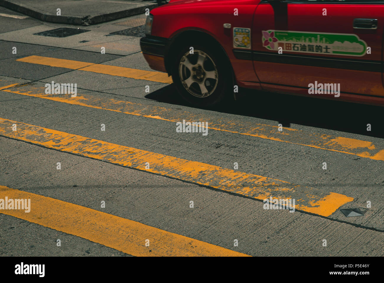HONG KONG - MAY 29, 2018: Red taxi car on road crossing in Hong Kong ...