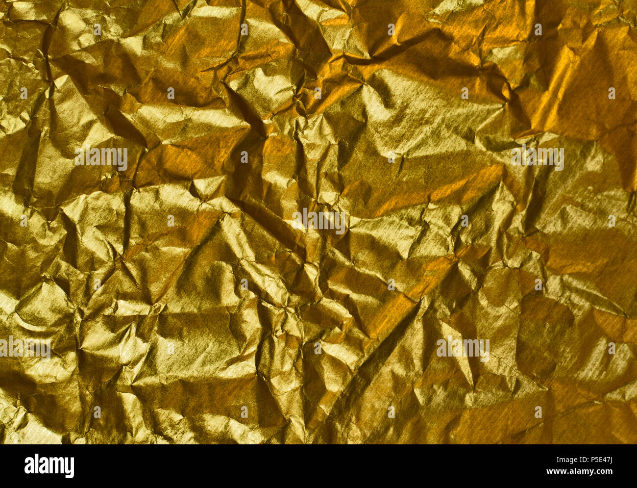 abstract background of wrinkled golden paper Stock Photo - Alamy
