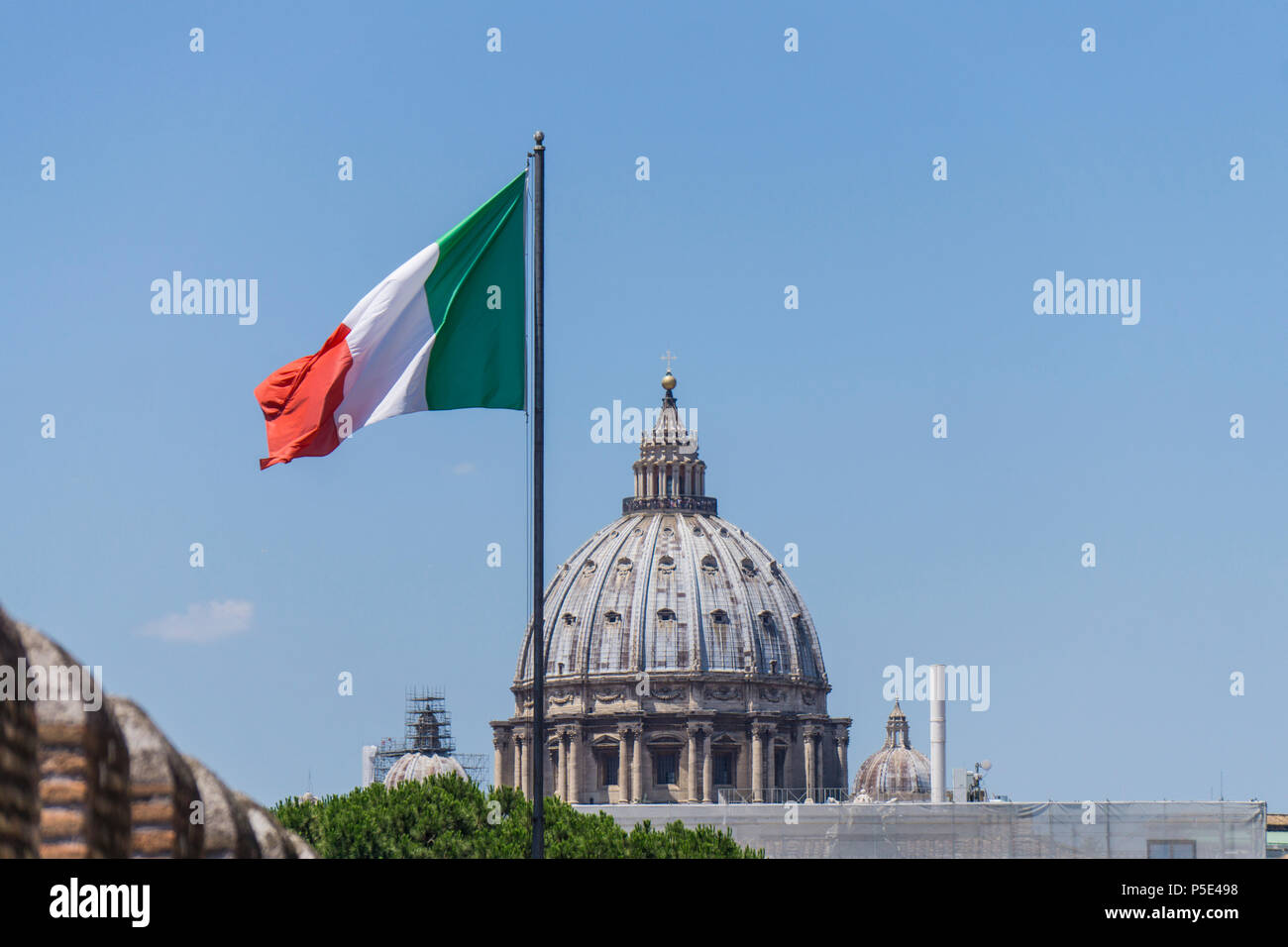 St Peter's basilica dome and Italian flag in Rome Stock Photo - Alamy