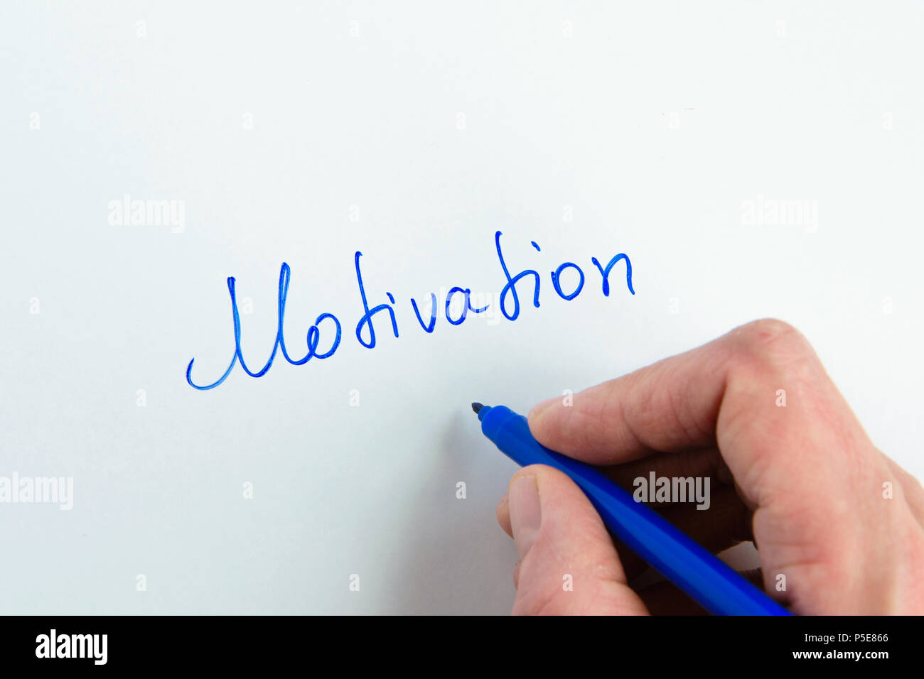 Woman hand writing the word "Motivation" on white background Stock ...
