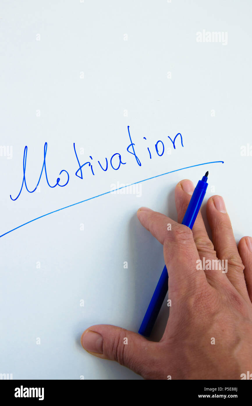 Woman hand writing the word "Motivation" on white background Stock ...