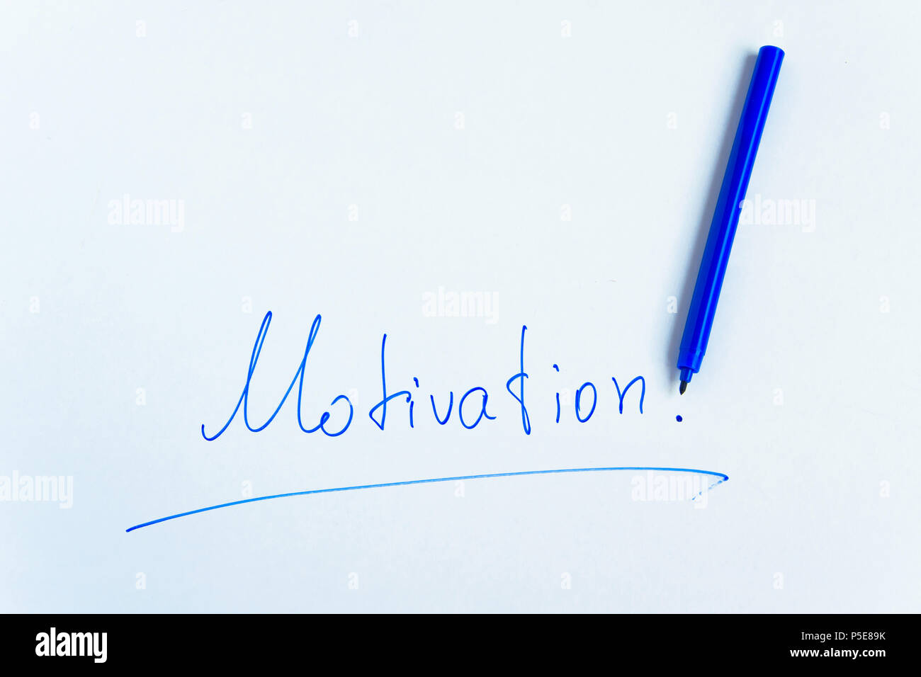 Handwritten motivational phrase "Motivation" on white background Stock ...