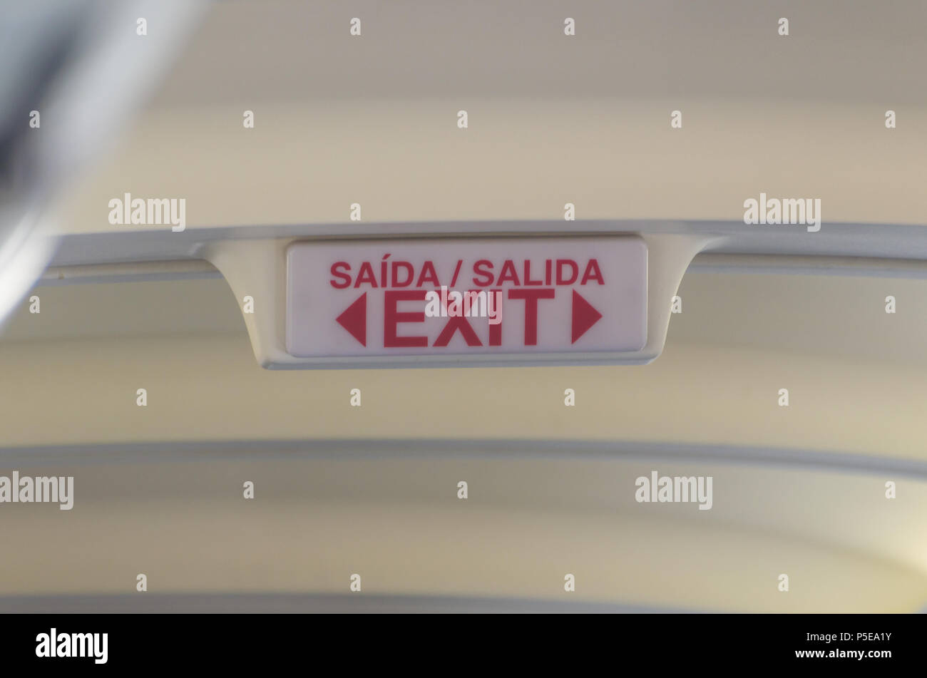 Emergency exit sign on a passenger plane Stock Photo - Alamy