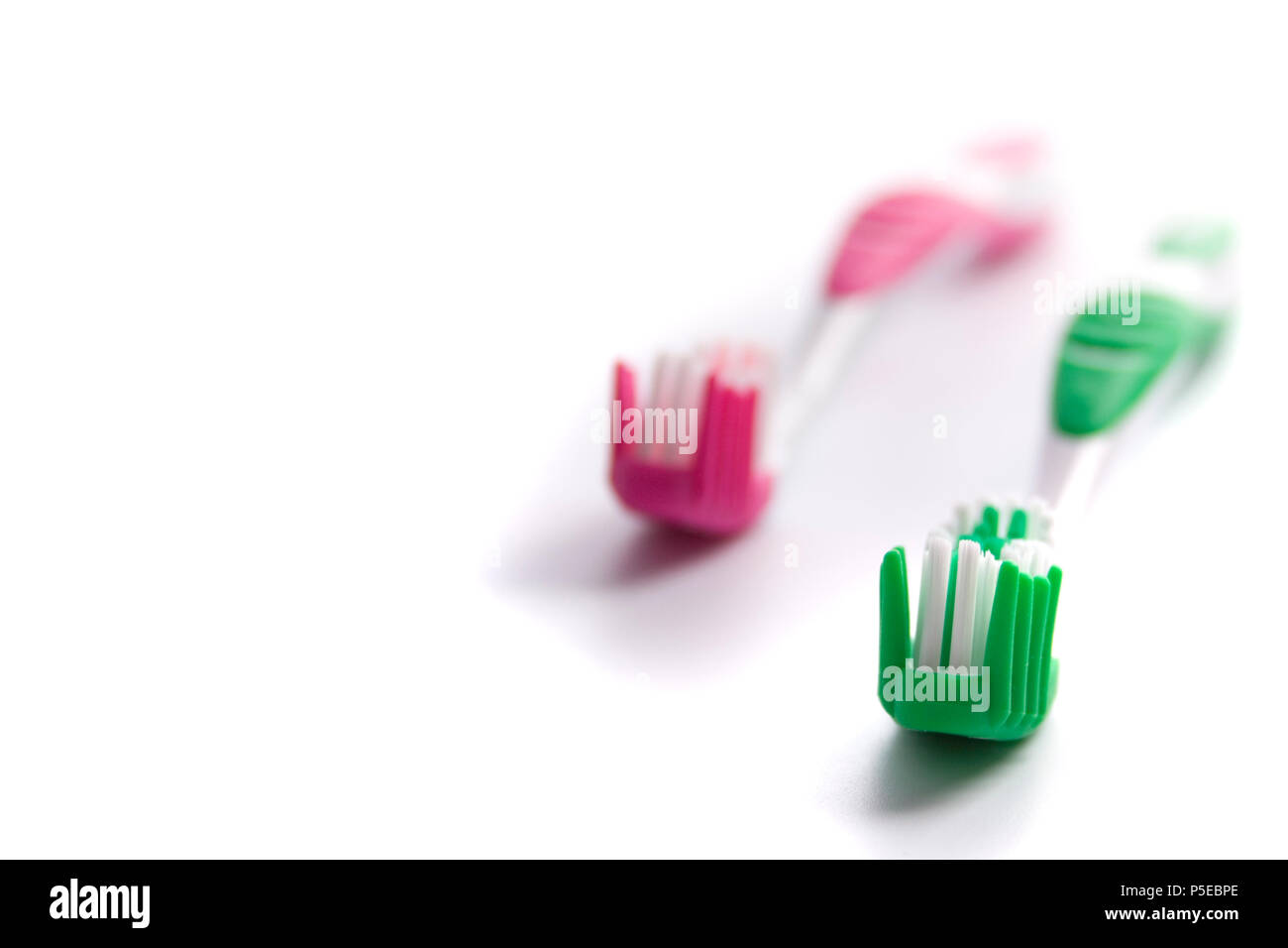 two toothbrushes on white background Stock Photo - Alamy