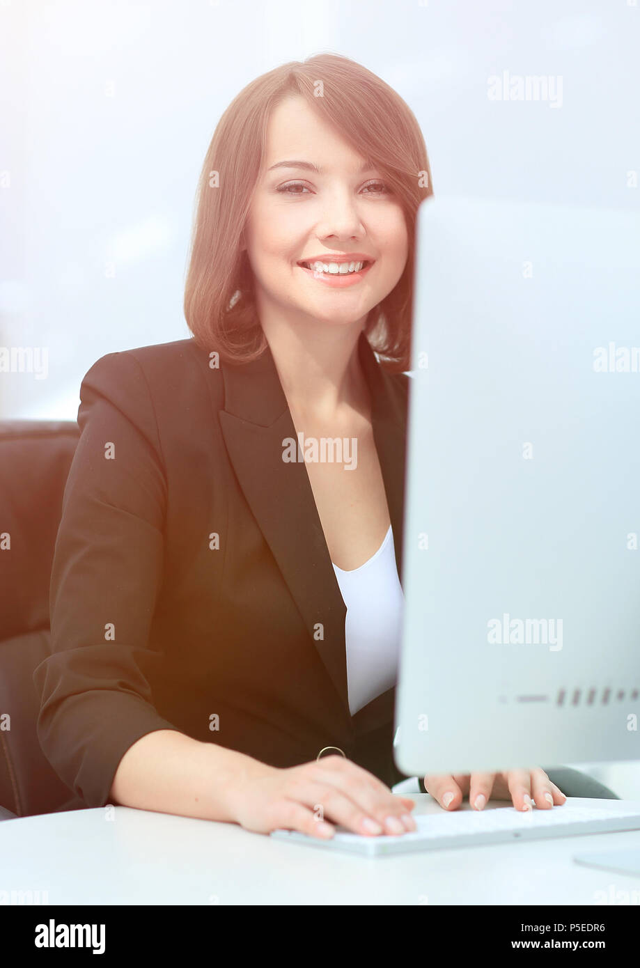 Business woman working with computer in an office Stock Photo - Alamy