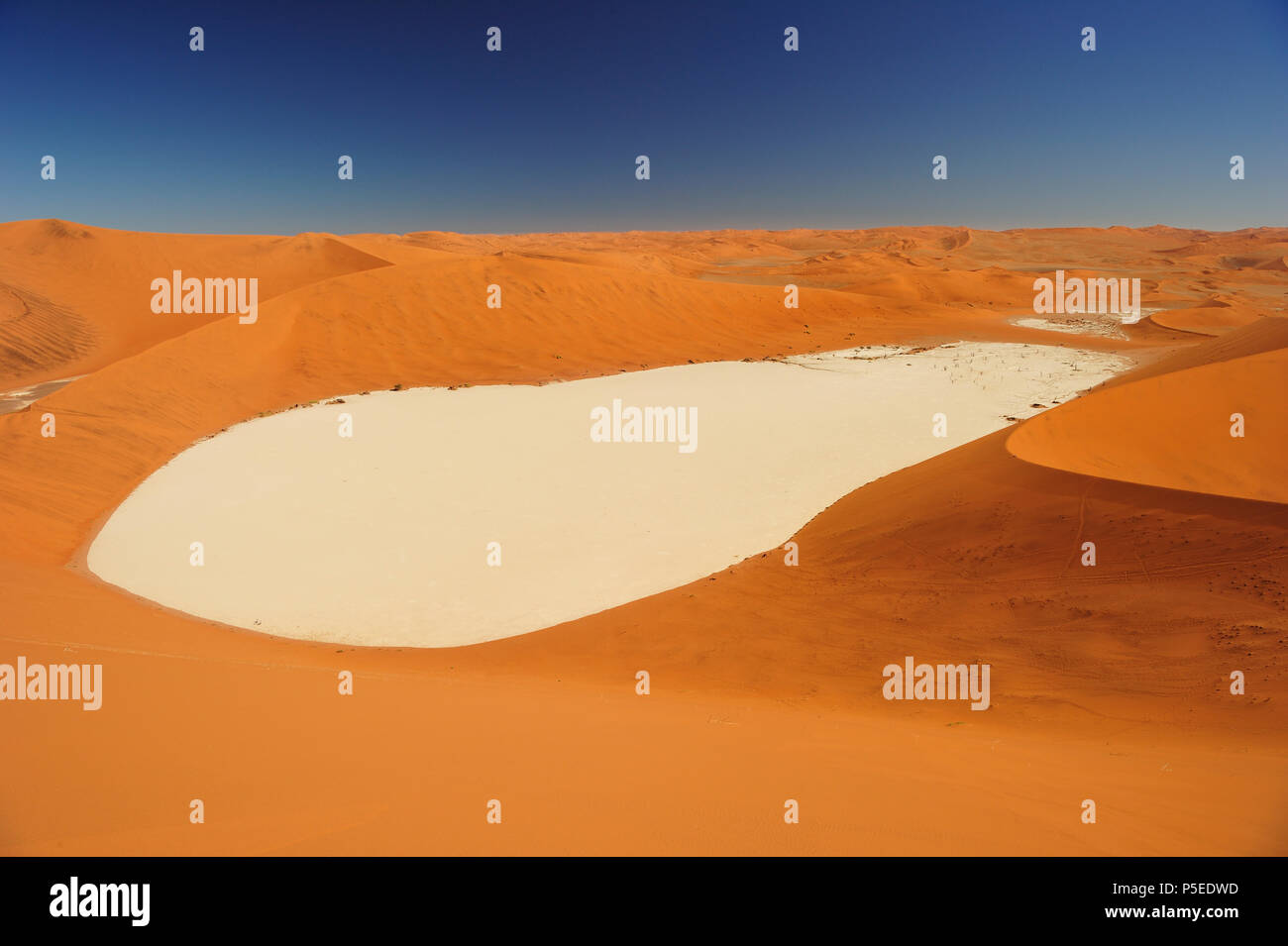 Salt pan between sand dunes, Sossusvlei, Namib Naukluft National Park ...
