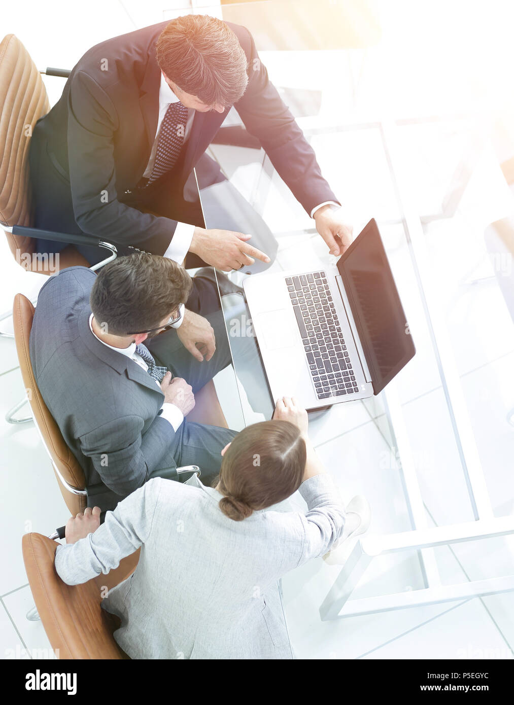 Business team working with laptop at work desk Stock Photo - Alamy
