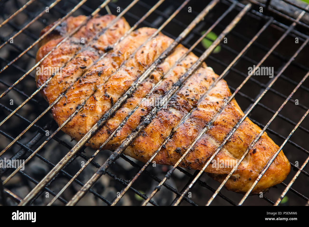 Fish char-grilled over flame Stock Photo - Alamy