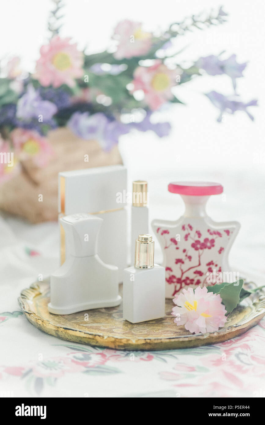 White perfume bottles on a white background Stock Photo - Alamy