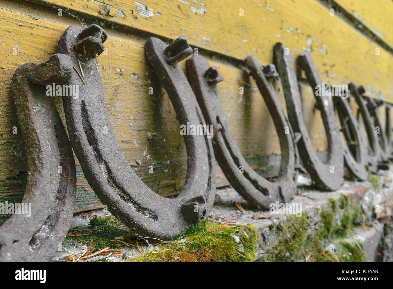 Background surface of very old and rusty horseshoes placed near the ...