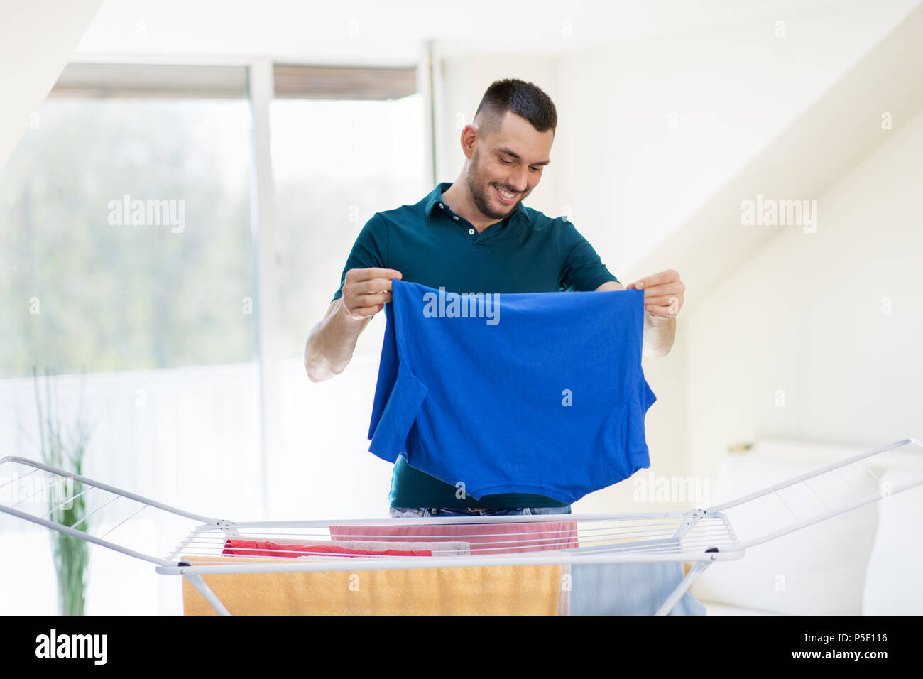 Folding clothes drying rack hi-res stock photography and images - Alamy