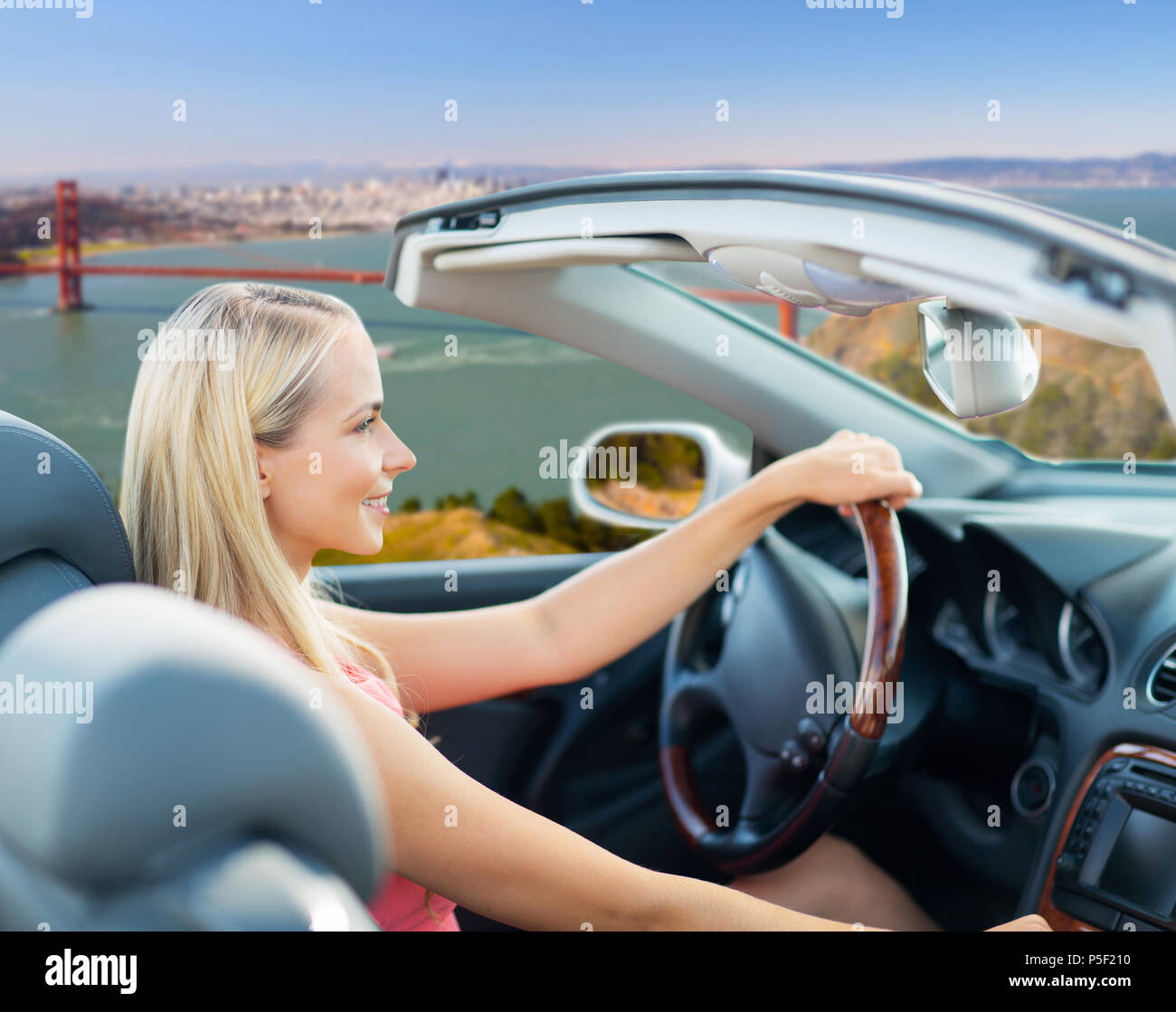 Woman driving car over bridge hi-res stock photography and images - Alamy